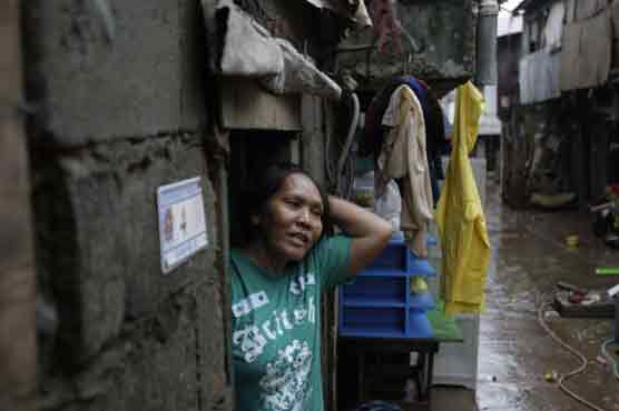 Evacuees return to mud, debris after Manila floods