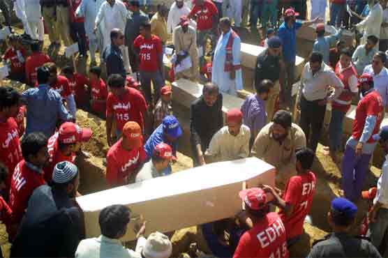 17 unclaimed bodies of Baldia factory fire buried