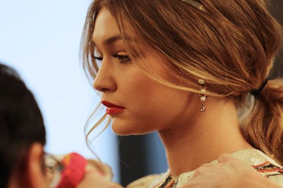Gigi stars in Hilfiger's trans-Atlantic NY runway